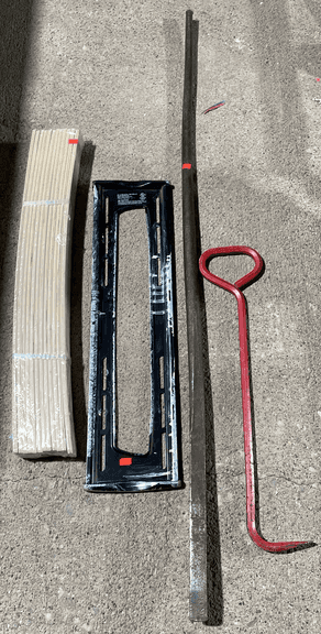 Metal rod, crow bar, wood pieces - Metzger Property Services, LLC