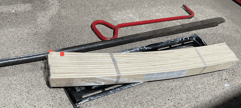 Metal rod, crow bar, wood pieces - Metzger Property Services, LLC