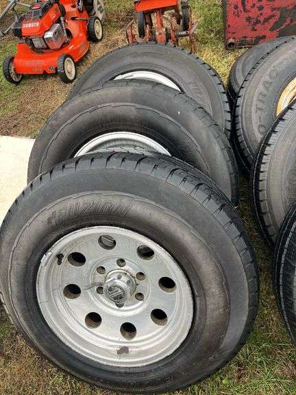 4 Aluminum rims and tires 205/75r16 - Metzger Property Services, LLC