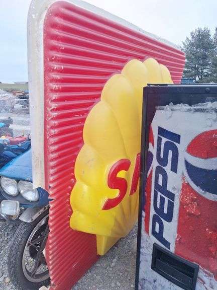 Shell plastic sign insert with damage - Metzger Property Services, LLC