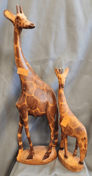 2- Carved Wood Giraffes - Metzger Property Services, LLC