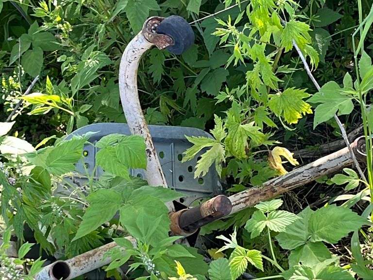 Air tank, wheels, steering wheel, and scrap assortment as shown in ...