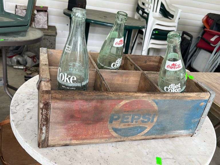 Pepsi case and 3 Coca-Cola bottles - Metzger Property Services, LLC