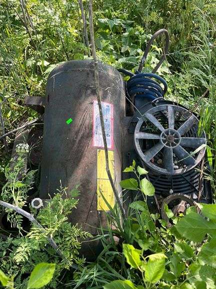 Air tank, wheels, steering wheel, and scrap assortment as shown in ...