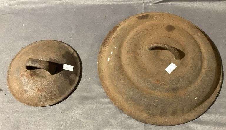 2) Cast Iron Lids - Metzger Property Services, LLC