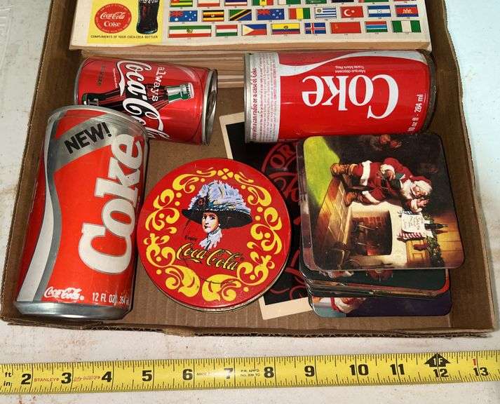 Coca-Cola cans, coasters, writing pads - Metzger Property Services, LLC