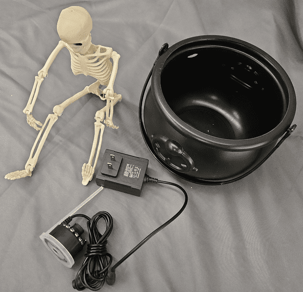 Skeleton Cauldron Halloween Decoration - Metzger Property Services, LLC