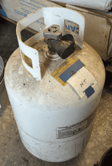 Empty propane tank - Metzger Property Services, LLC