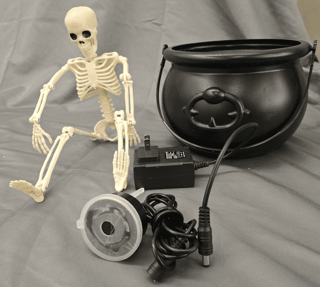 Skeleton Cauldron Halloween Decoration - Metzger Property Services, LLC