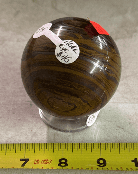 Tiger Eye sphere on stand - Metzger Property Services, LLC