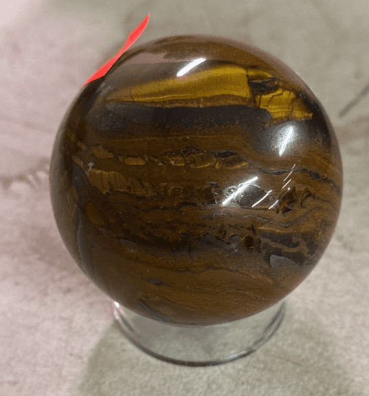 Tiger Eye sphere on stand - Metzger Property Services, LLC