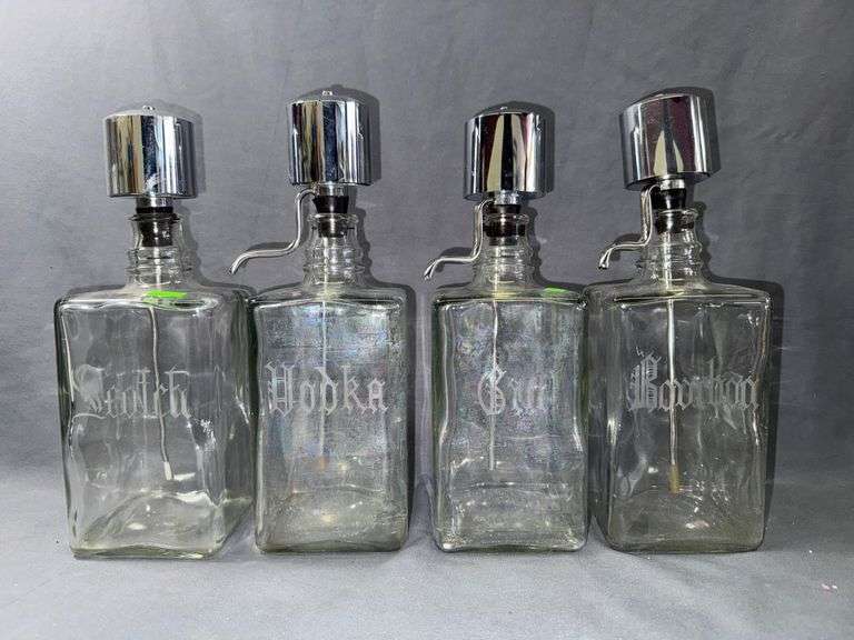 Four Glass Liquor Dispensers with Chrome Pumps Labeled Scotch, Vodka ...