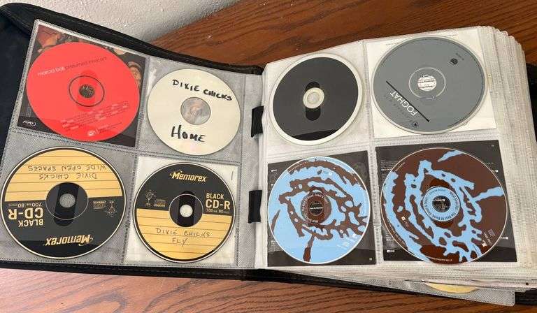 Music CDs in a Black Zippered Case - Metzger Property Services, LLC