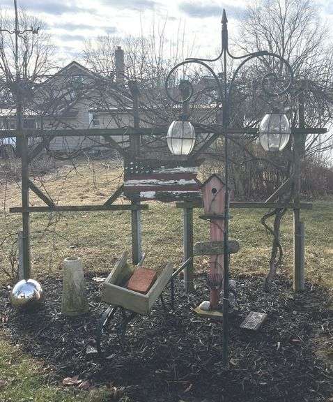 Garden decor as shown in pictures wheel barrow, gazing ball , birdhouse ...
