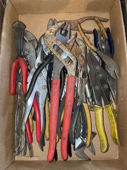 Hand tool assortment including pipe wrench, pliers, wrench, wire ...