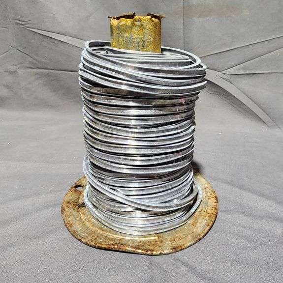 Coiled Metal Wire with Rusted Base - Metzger Property Services, LLC