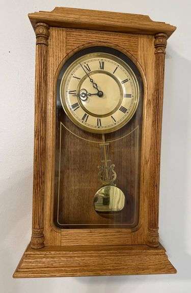 Wall-Mounted Pendulum Clock with Roman Numeral Dial - Metzger Property ...