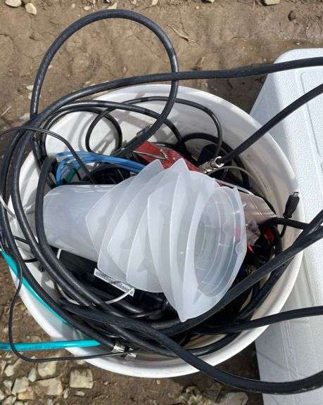 Bucket Containing Cables, Chargers, and Plastic Funnels - Metzger ...