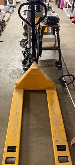 Yellow Manual Pallet Jack with Steel Forks - Metzger Property Services, LLC