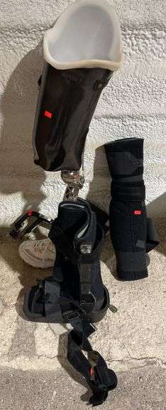 Prosthetic leg with women’s shoe, walking cast, knee brace, wheelchair ...