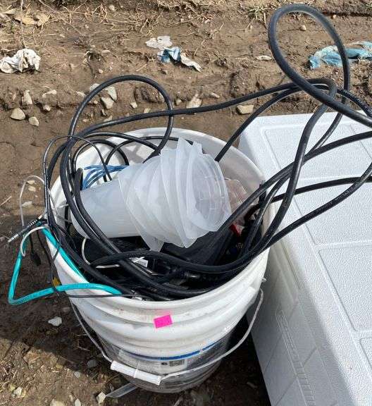 Bucket Containing Cables, Chargers, and Plastic Funnels - Metzger ...