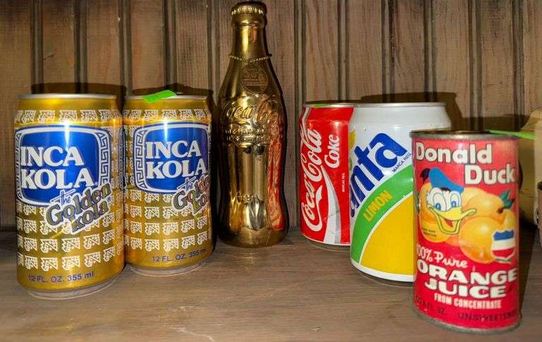 Inca Kola, Coca-Cola, Fanta, and Donald Duck Orange Juice Cans with ...