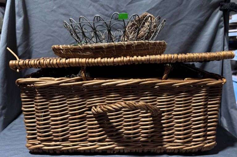 Wicker Basket with Books, Frames, and Wire Baskets - Metzger Property Services, LLC