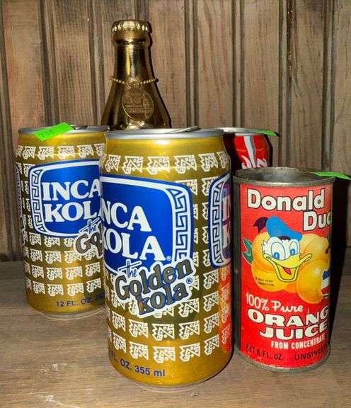 Inca Kola, Coca-Cola, Fanta, and Donald Duck Orange Juice Cans with ...