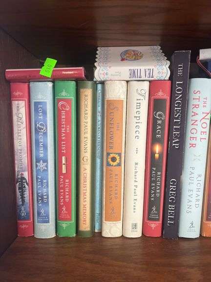 Bookshelf With Hardcover and Paperback Books From Various Authors ...