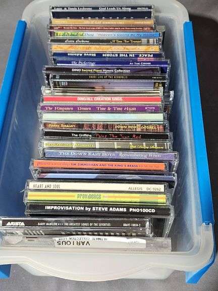 Plastic Storage Container with Assorted Music CDs - Metzger Property ...