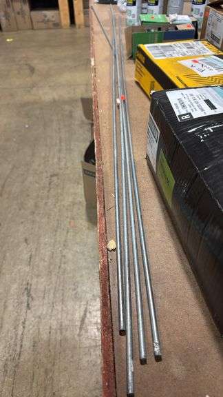 4- assorted 72” metal rods - Metzger Property Services, LLC
