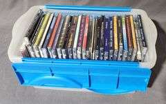 Plastic Storage Container with Assorted Music CDs - Metzger Property ...