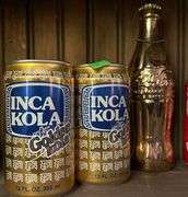 Inca Kola, Coca-Cola, Fanta, and Donald Duck Orange Juice Cans with ...