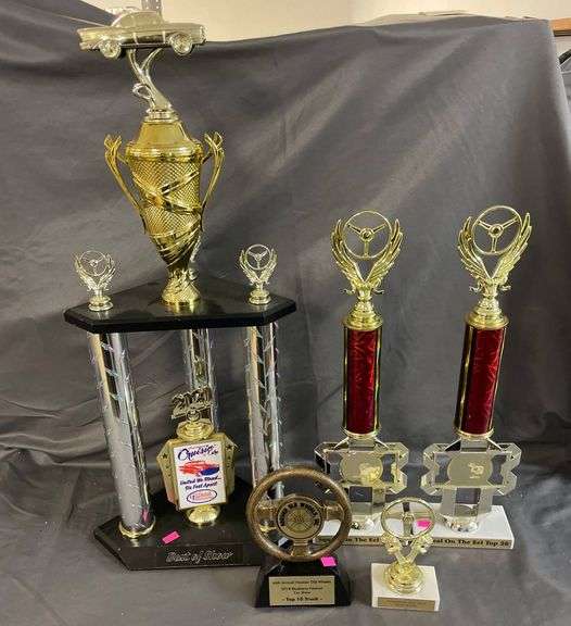 5 Automotive-Themed Trophies with Various Designs - Metzger Property ...
