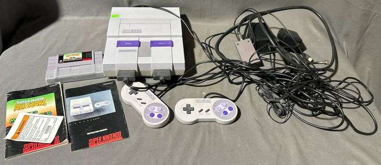 Super Nintendo Entertainment System with Controllers, Game, and Manuals ...