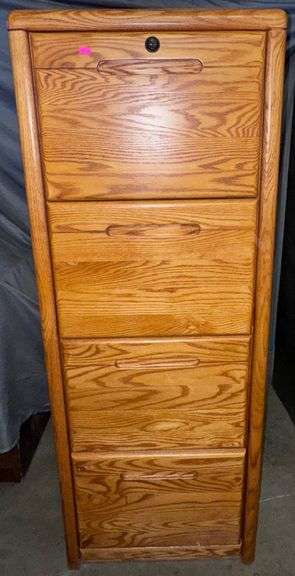 Four-Drawer Oak Filing Cabinet - Metzger Property Services, LLC
