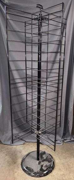 Metal Rotating Display Rack With Wire Grids and Weighted Base - Metzger ...