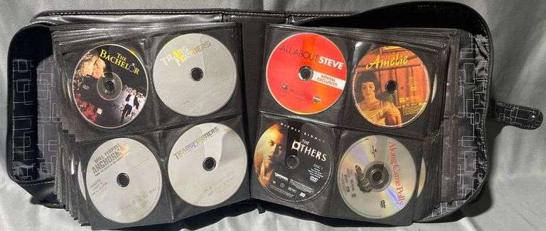 Black CD/DVD Binder with Assorted Discs - Metzger Property Services, LLC