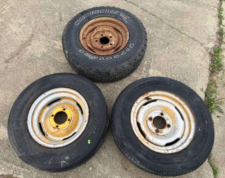 Three Rims with Mounted Tires - Metzger Property Services, LLC