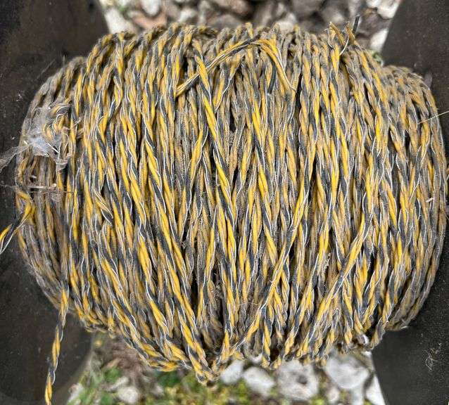 Spool of Black and Yellow Braided Wire - Metzger Property Services, LLC