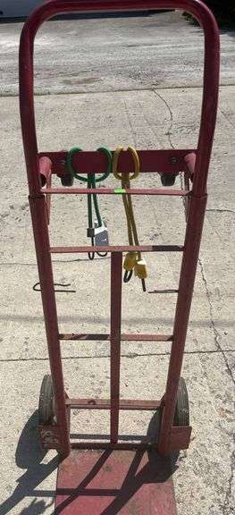 Red Metal Hand Truck with Bungee Cords - Metzger Property Services, LLC