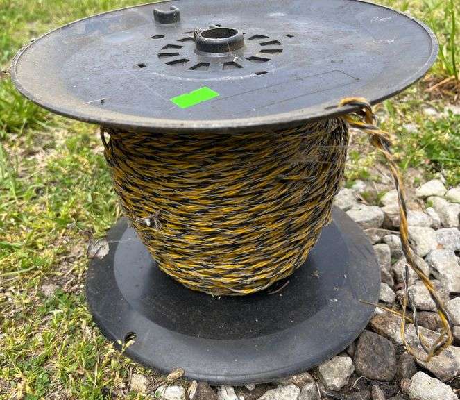 Spool of Black and Yellow Braided Wire - Metzger Property Services, LLC