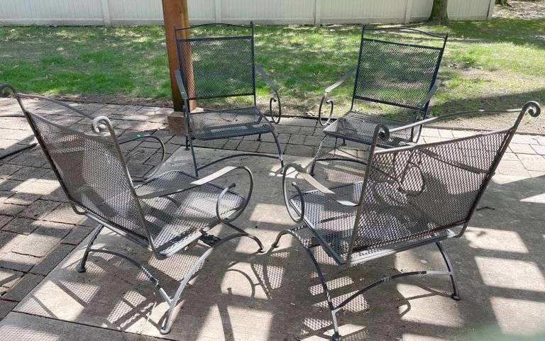 Four Black Metal Outdoor Mesh Chairs with Scrolled Arms and Legs ...