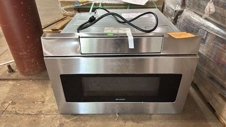 Sharp microwave with dent - Metzger Property Services, LLC
