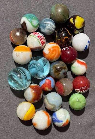 25 Marbles Featuring Coca-Cola and Pepsi Branding - Metzger Property Services, LLC