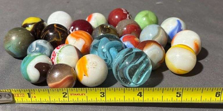 25 Marbles Featuring Coca-Cola and Pepsi Branding - Metzger Property Services, LLC