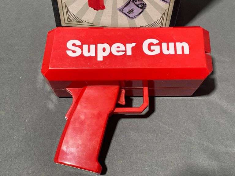 Red Plastic ‘Super Gun’ with Packaging - Metzger Property Services, LLC