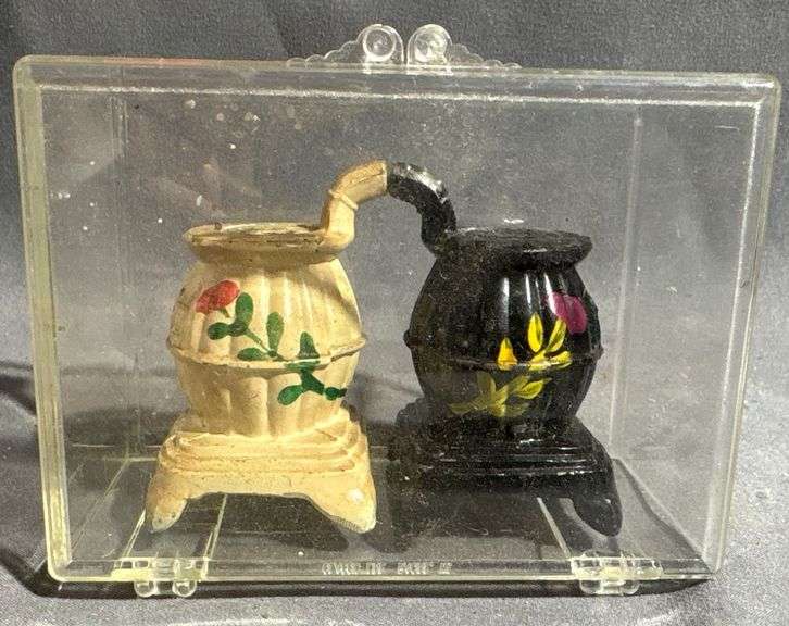 Two Cast Iron Figural Pot-Shaped Salt and Pepper Shakers in Display ...
