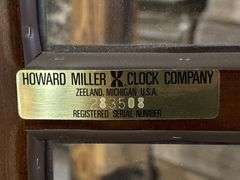 Howard Miller Grandfather Clock with Tempus Fugit Dial and Brass ...