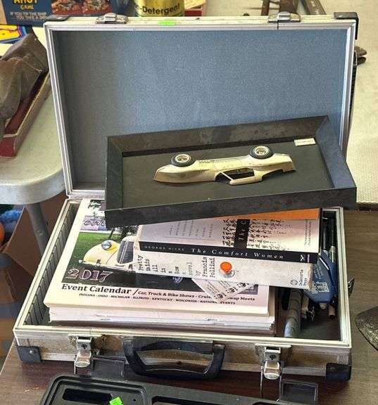 Metal Briefcase Containing Die-Cast Car Model, Calendars, Books, and ...